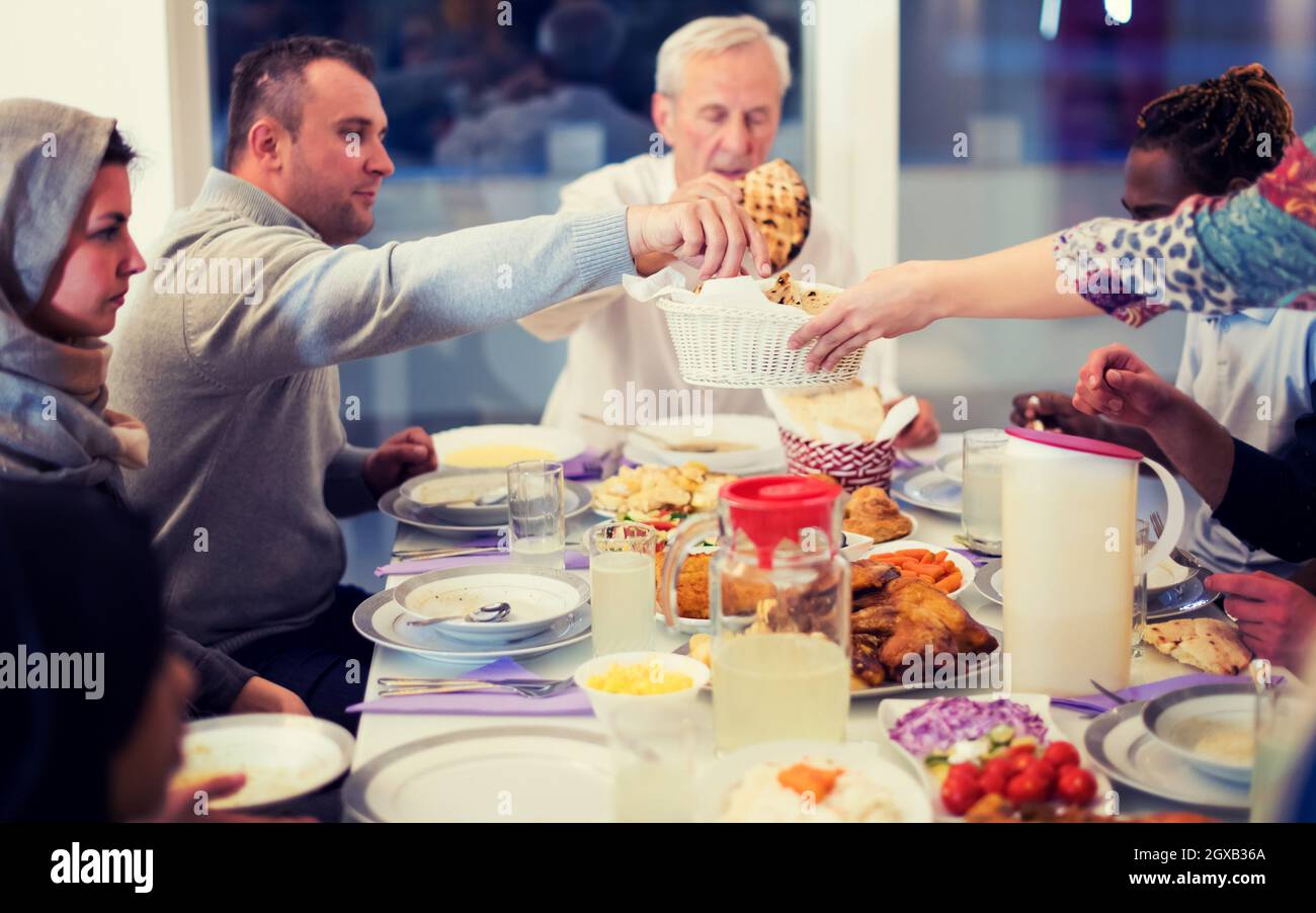 modern multiethnic muslim family enjoying eating iftar dinner together ...