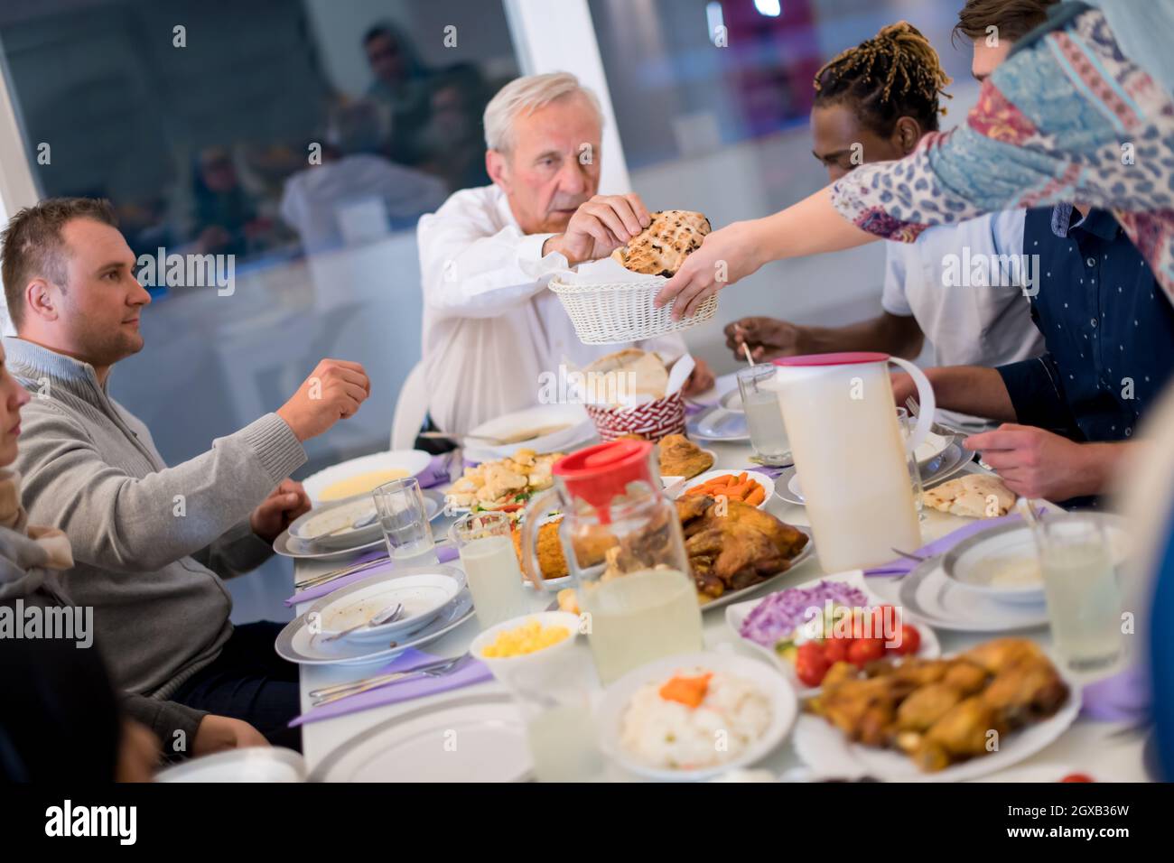 modern multiethnic muslim family enjoying eating iftar dinner together ...