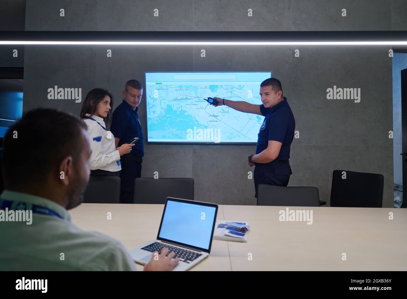Group of Security data center operators working in a CCTV monitoring ...