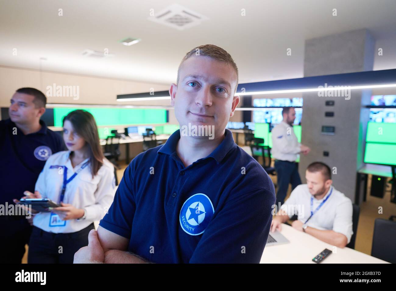 portrait of young male security operator working in a data system ...