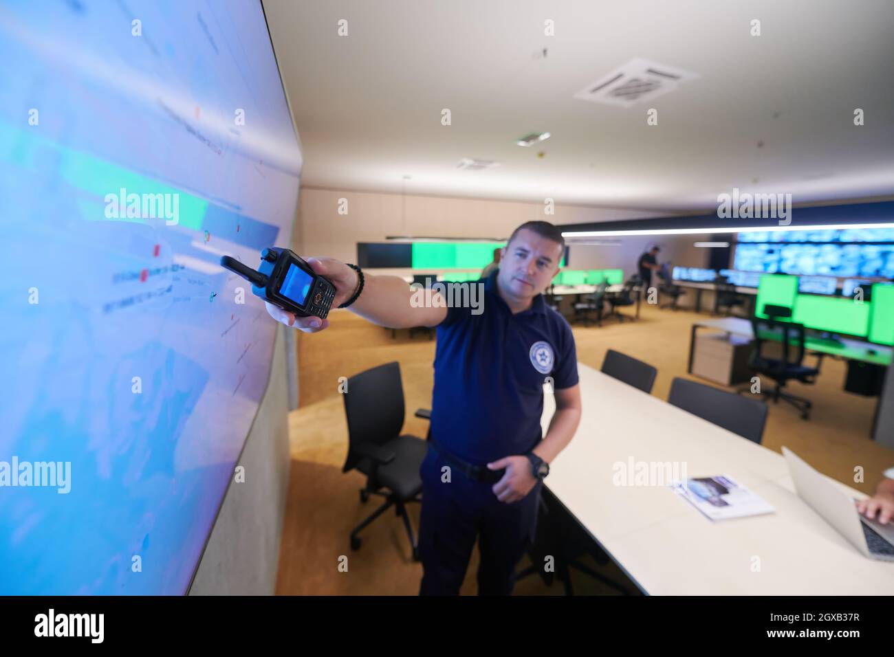 portrait of young male security operator working in a data system ...