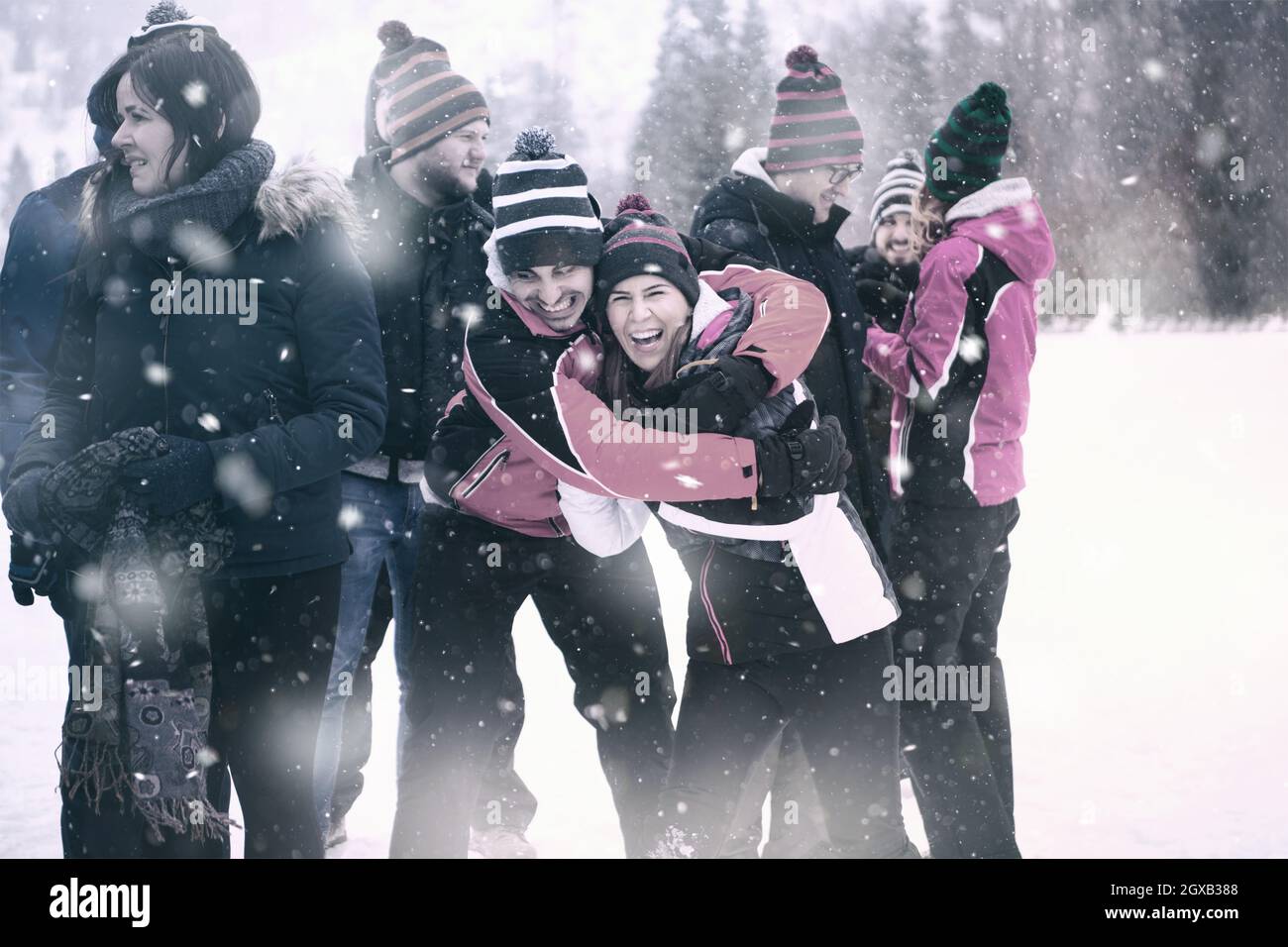 group portrait of young happy business people enjoying snowy winter day ...