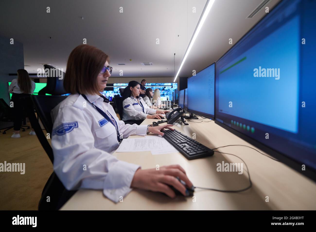 Group of Security data center operators working in a CCTV monitoring ...