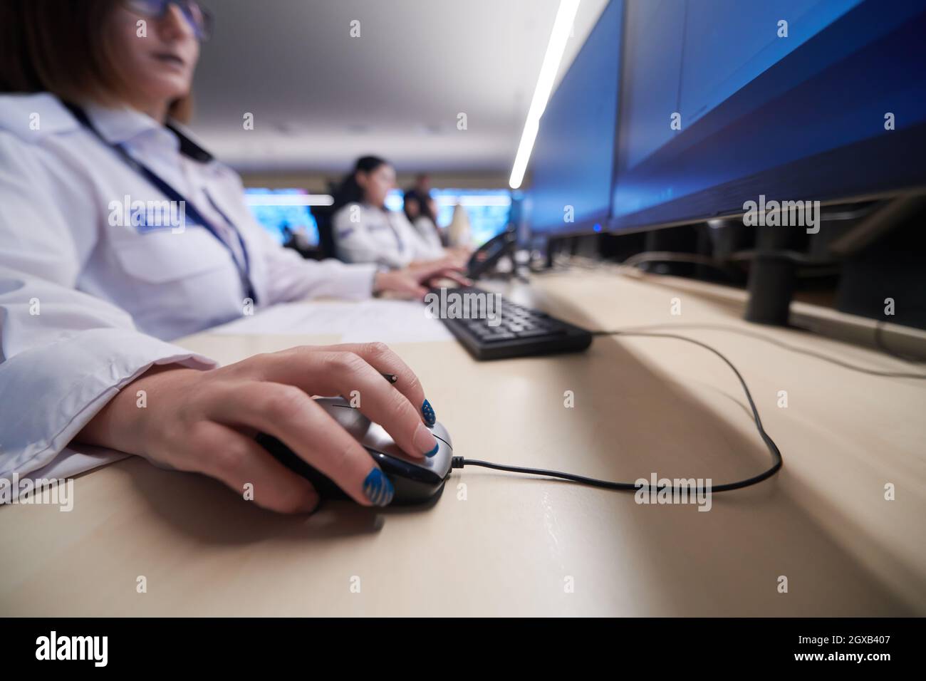Group of Security data center operators working in a CCTV monitoring ...