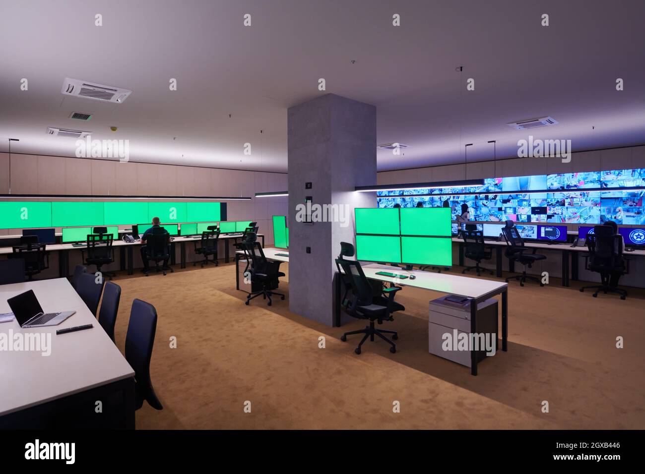 Group of Security data center operators working in a CCTV monitoring ...