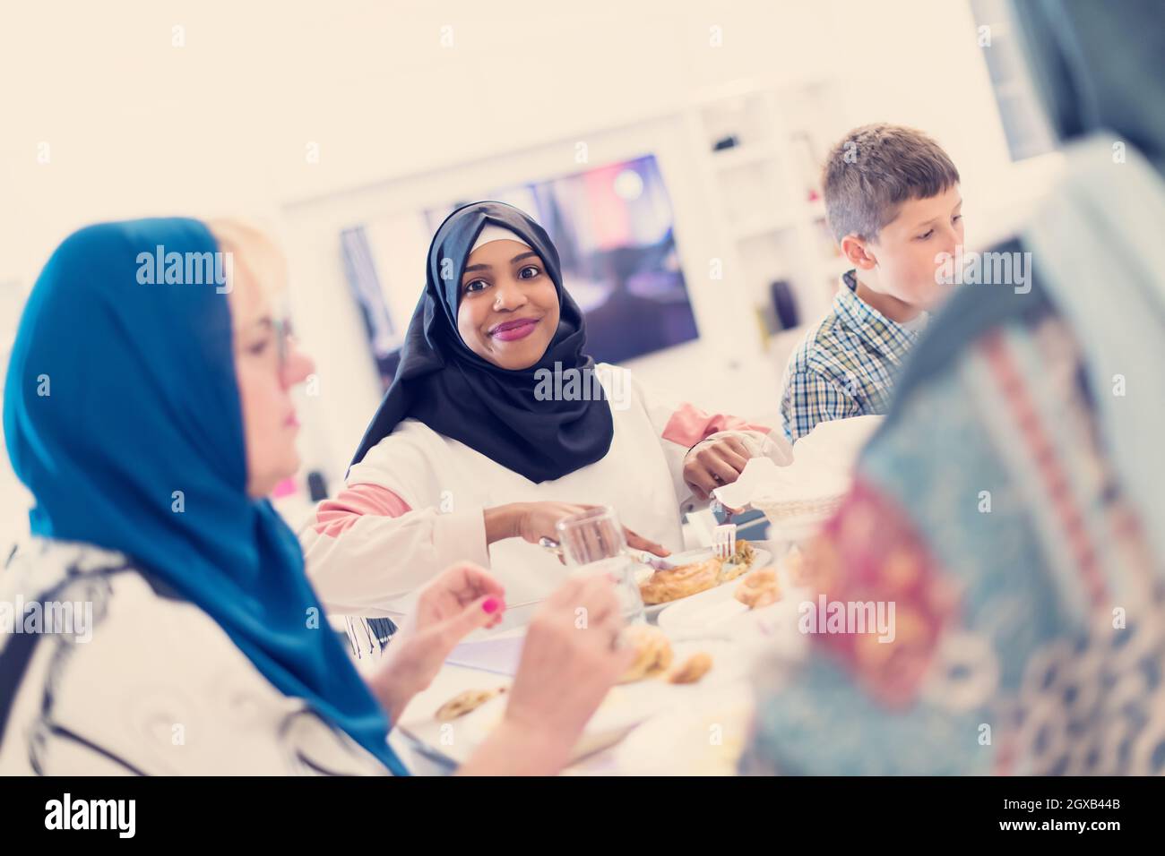 modern african american muslim woman enjoying iftar dinner together ...