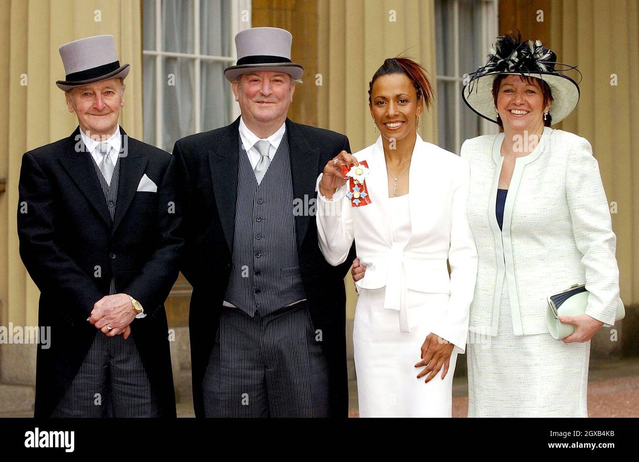 Double Olympic gold medallist Dame Kelly Holmes (second right) with her ...
