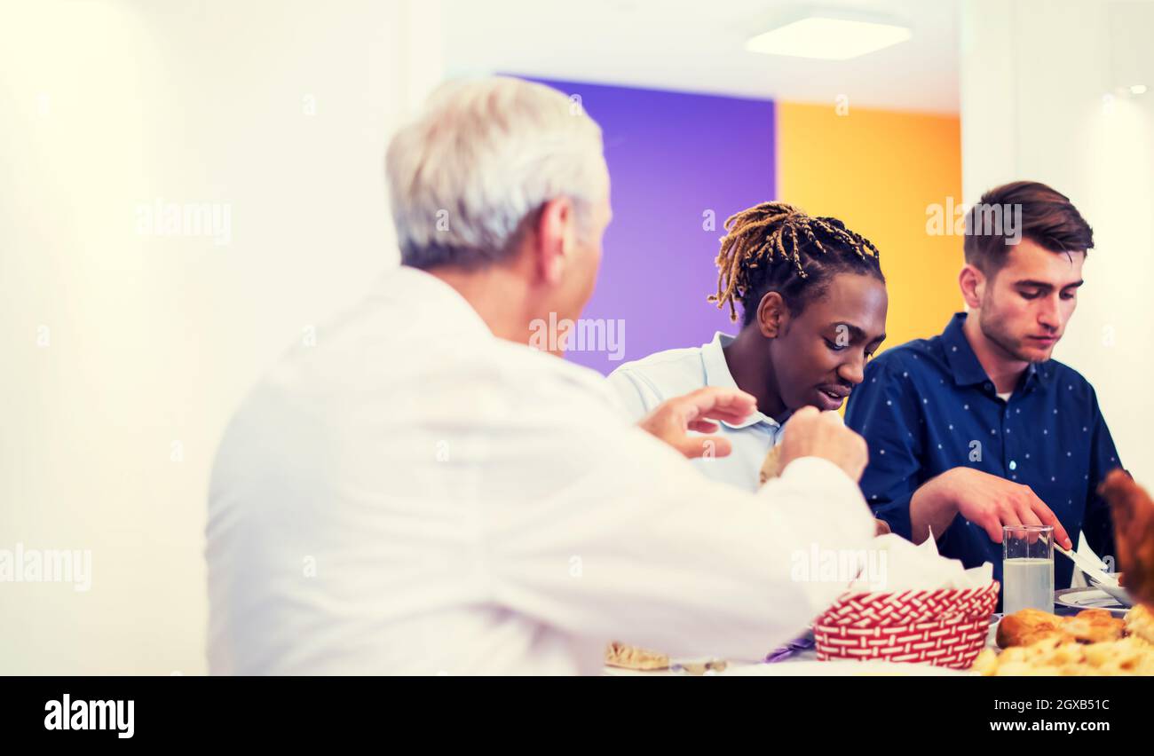 african american man enjoying iftar dinner together with modern ...