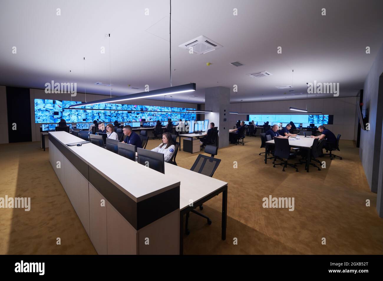 Group of Security data center operators working in a CCTV monitoring ...