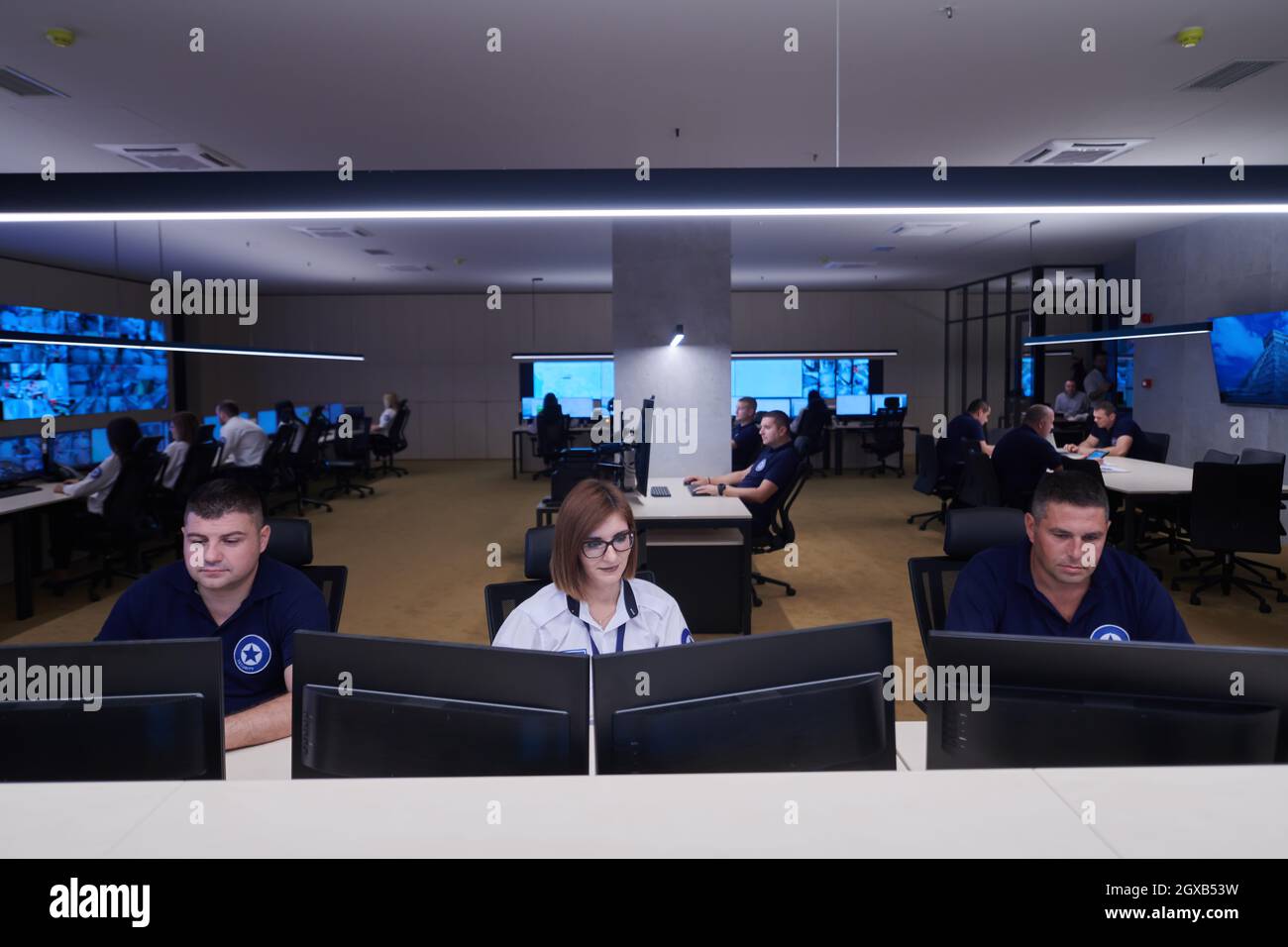 Group of Security data center operators working in a CCTV monitoring ...