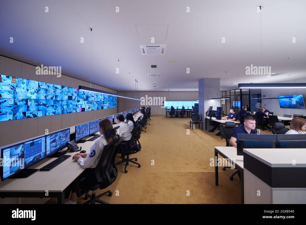 Group of Security data center operators working in a CCTV monitoring ...