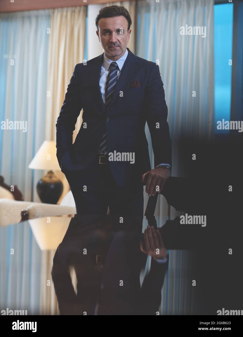 Senior executive businessman at luxury corporate workspace. Portrait of ...