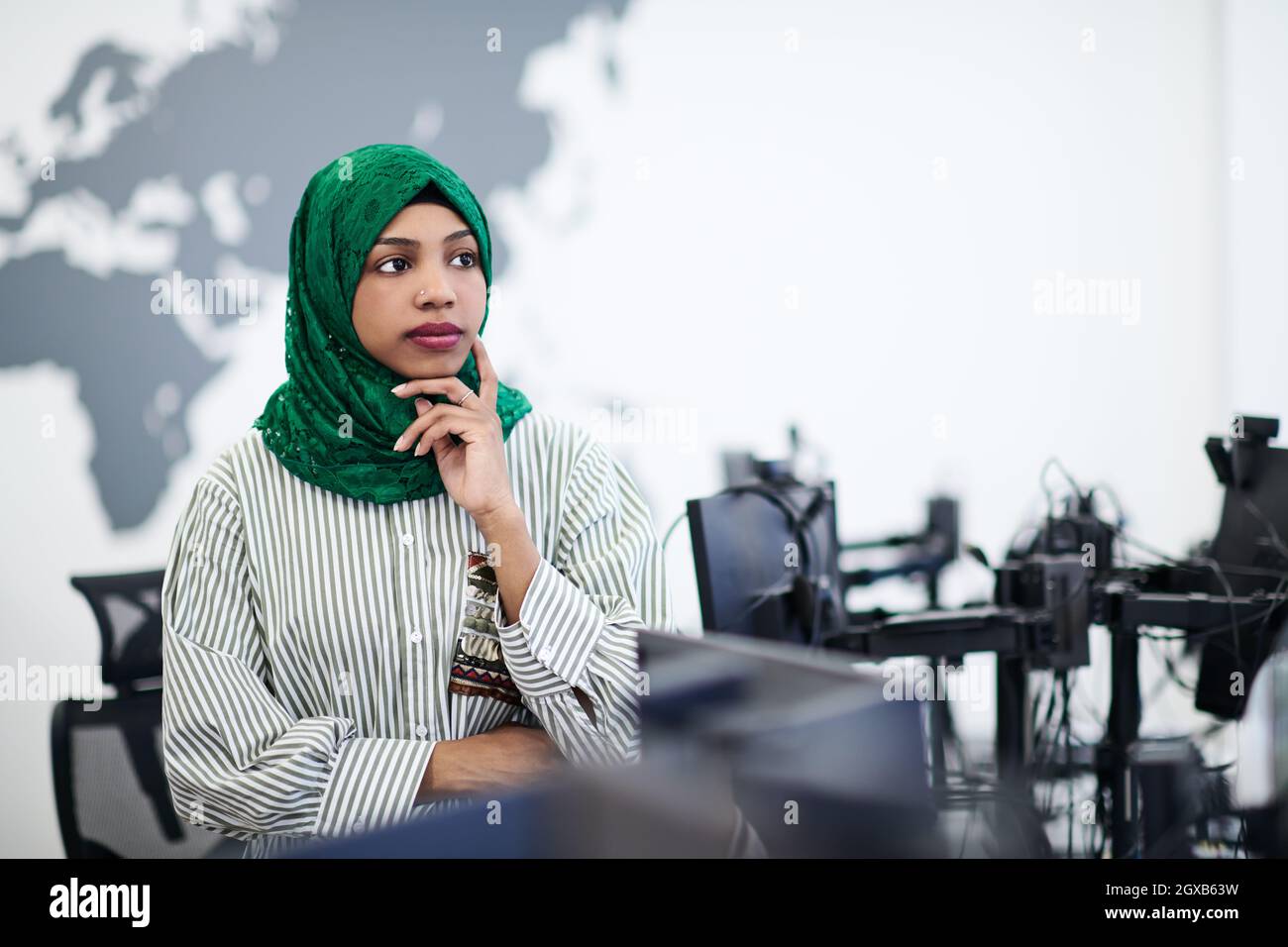 Portrait of muslim african female software developer with green hijab ...
