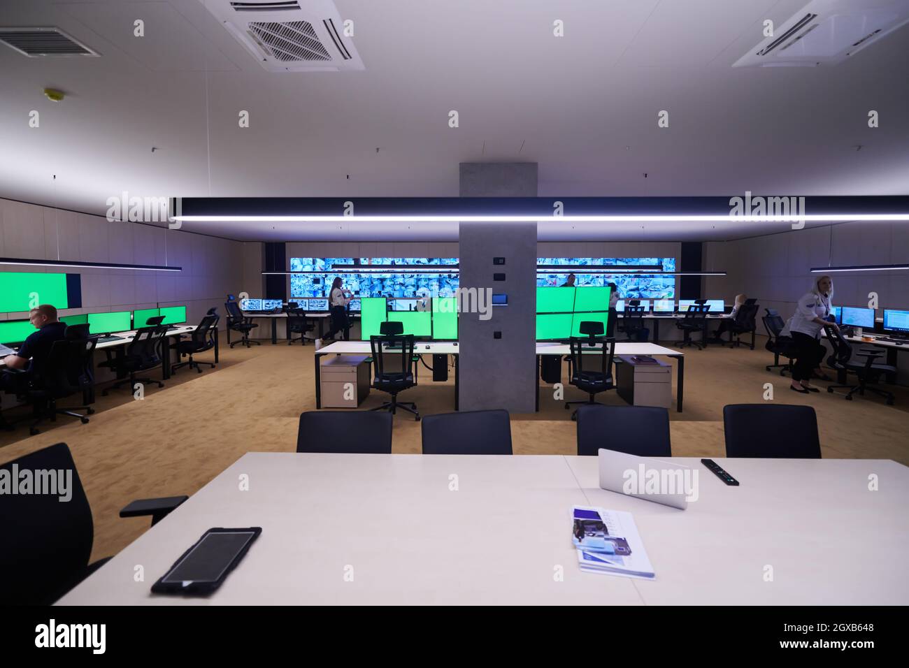 Group of Security data center operators working in a CCTV monitoring ...