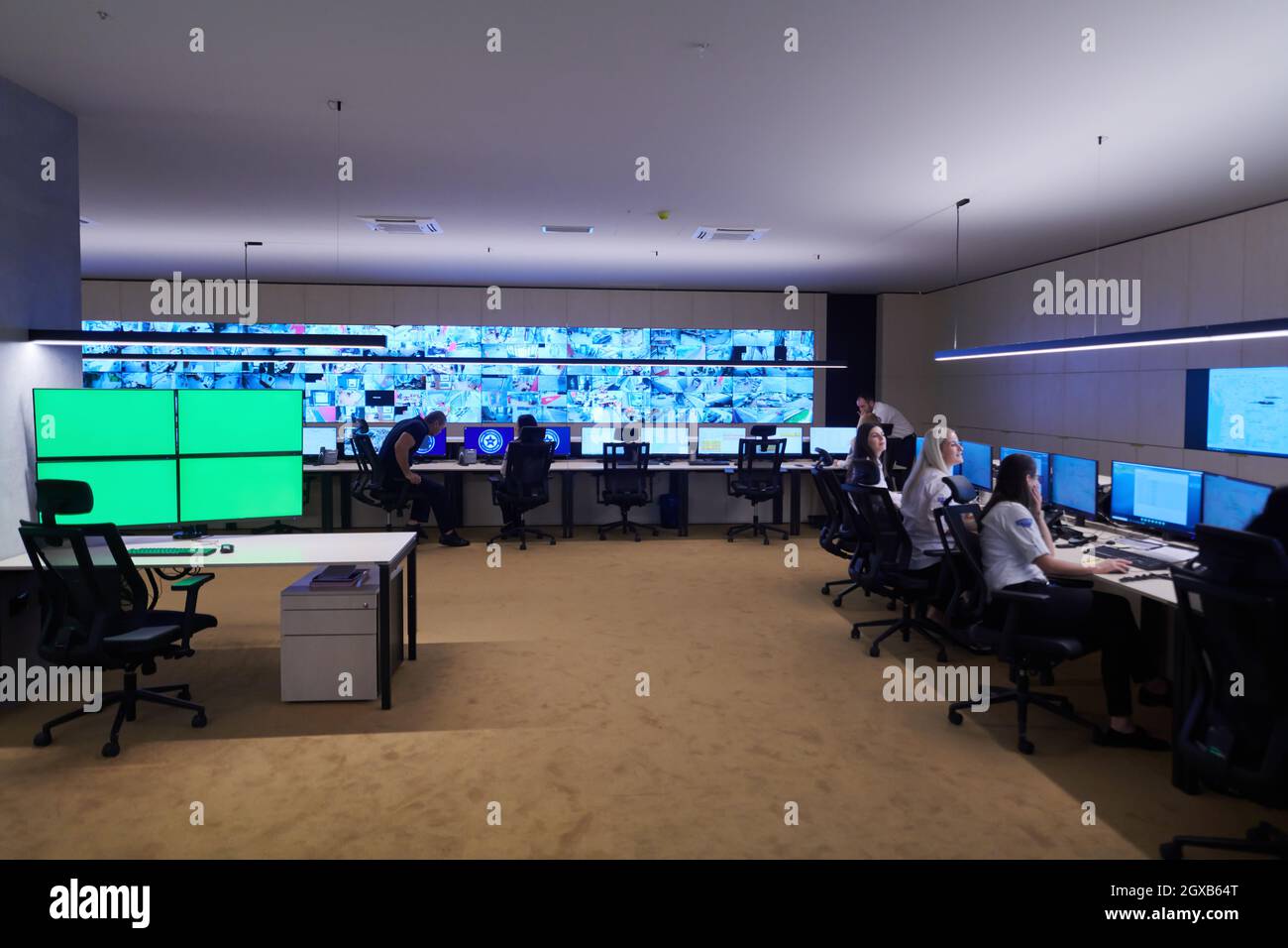 Group of Security data center operators working in a CCTV monitoring ...