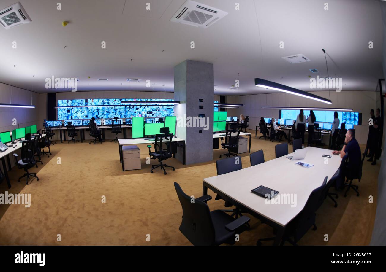 Group of Security data center operators working in a CCTV monitoring ...