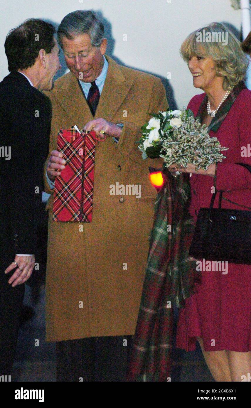 Prince Charles and Camilla Parker Bowles arrive at Aberdeen airport ...