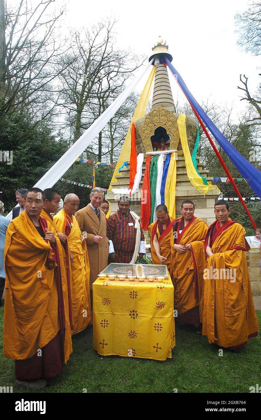 The Prince of Wales stands with a group of Bhutanese monks in front of ...