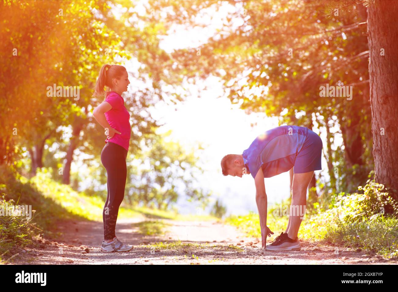 young happy couple enjoying in a healthy lifestyle warming up and ...