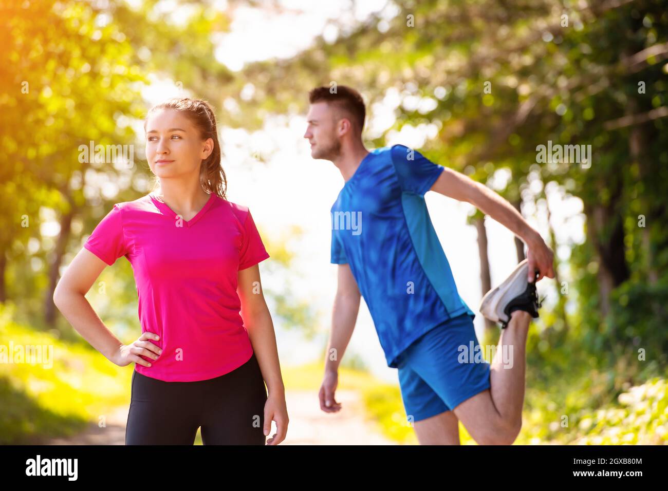 young happy couple enjoying in a healthy lifestyle warming up and ...