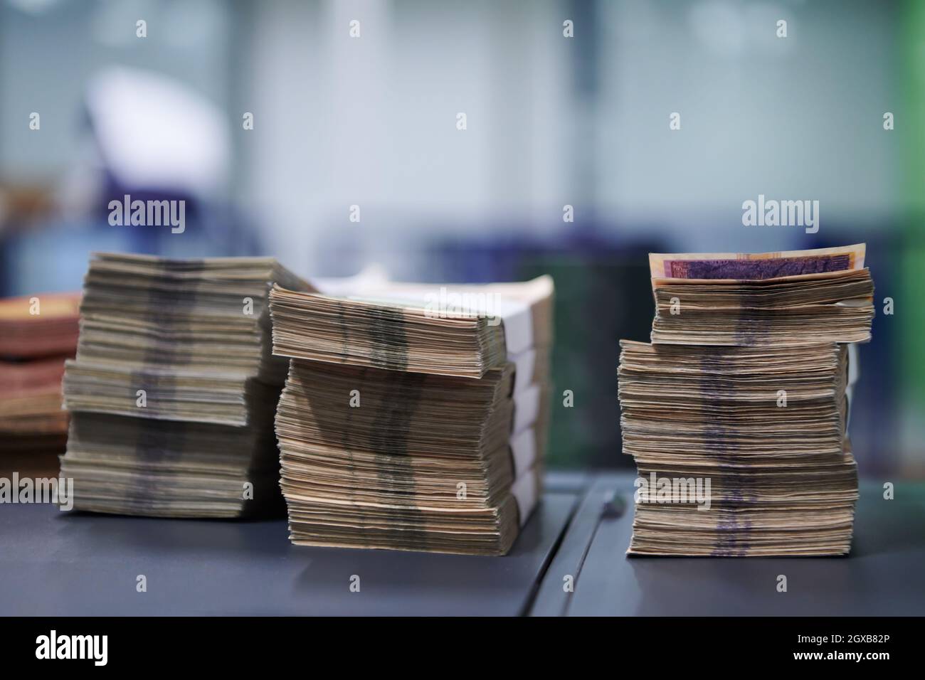 Sorted banknotes placed on the table after it is counted on the ...
