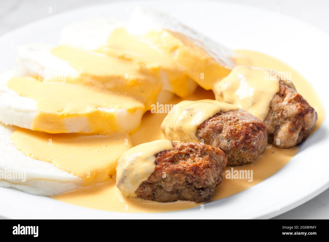 minced meat ball with creamy sauce and dumplings Stock Photo - Alamy