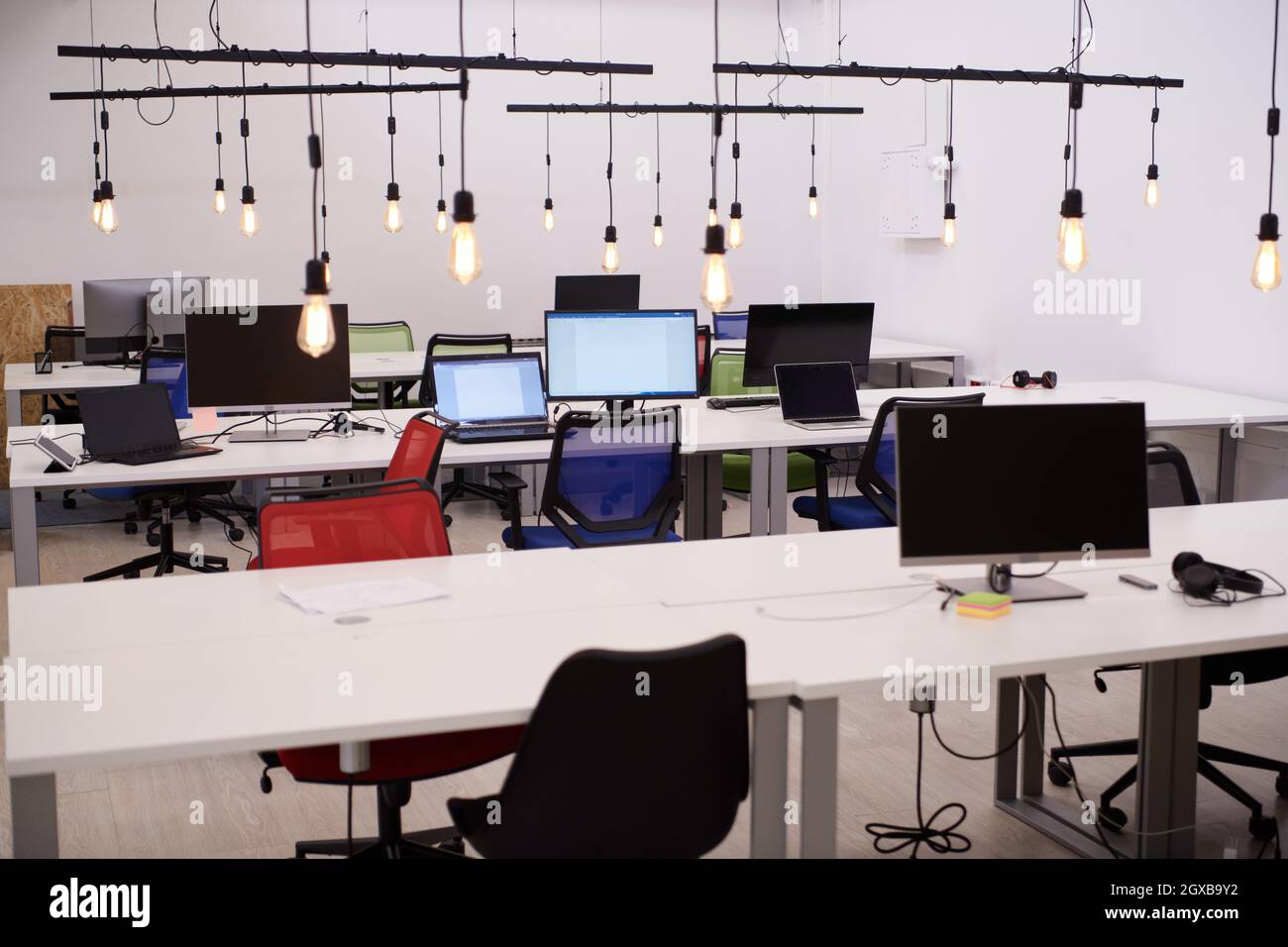 empty startup office interior with modern computer screens and designer furniture Stock Photo ...