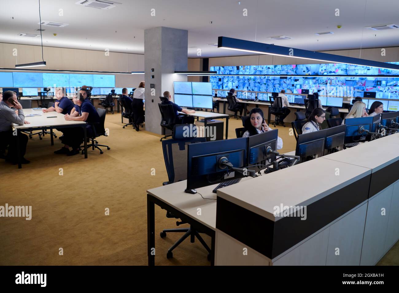 Group of Security data center operators working in a CCTV monitoring ...