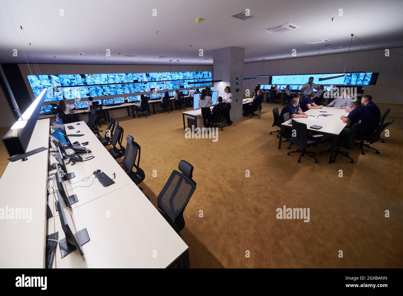 Group of Security data center operators working in a CCTV monitoring ...