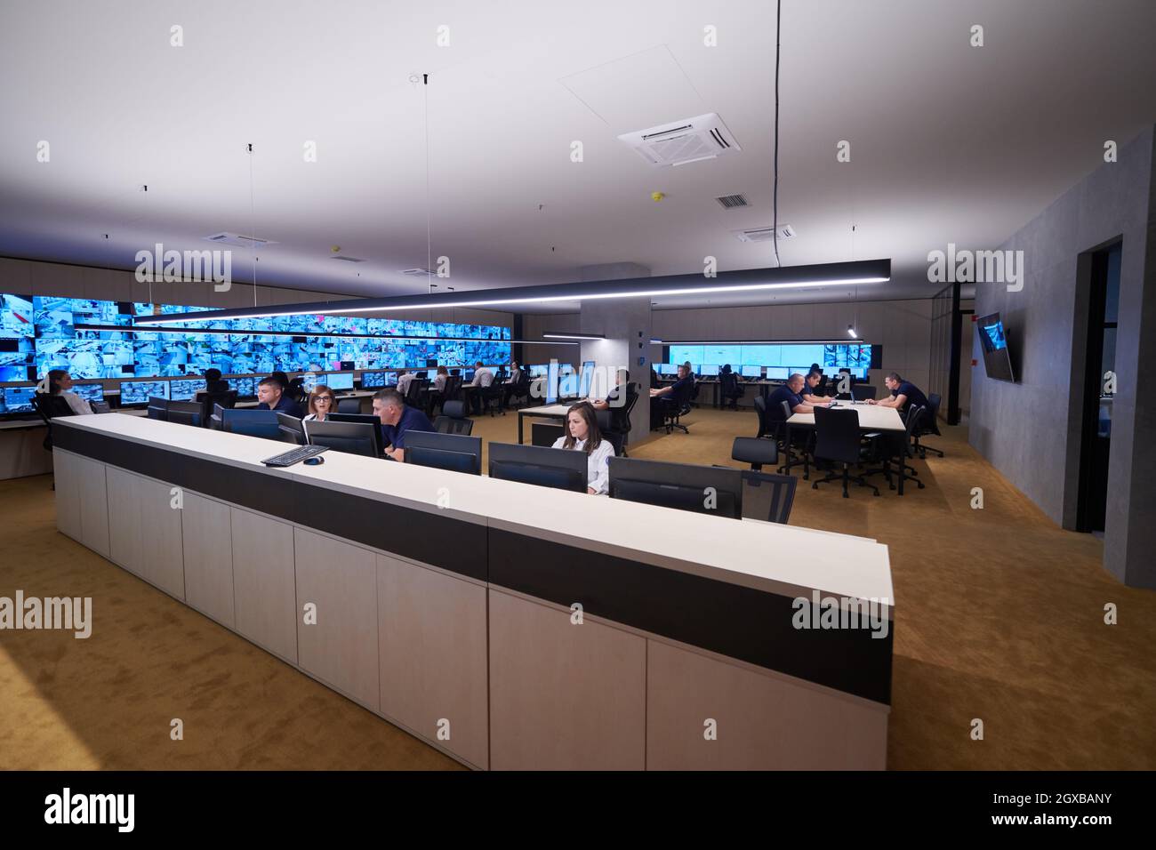 Group of Security data center operators working in a CCTV monitoring ...