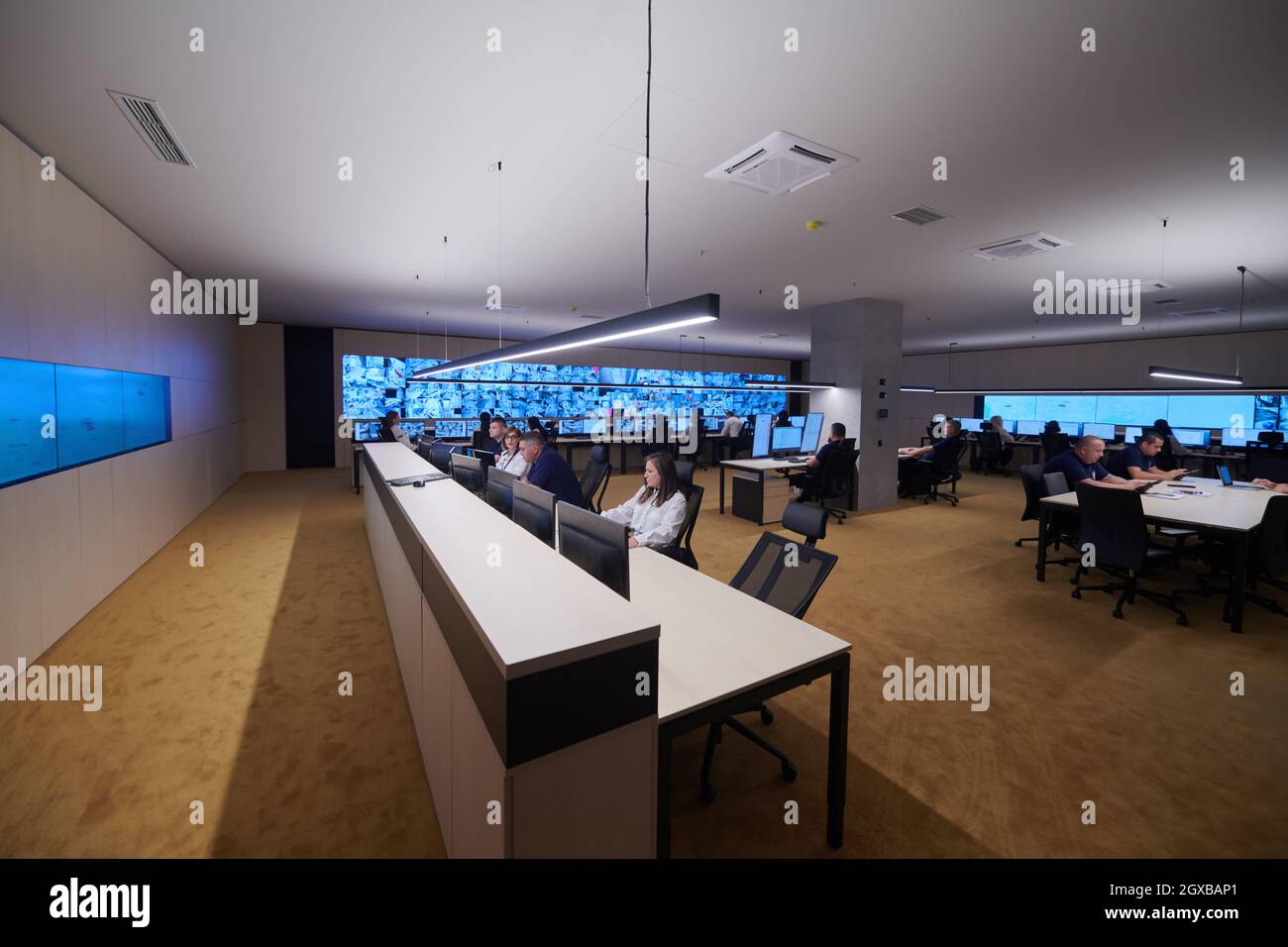 Group of Security data center operators working in a CCTV monitoring ...