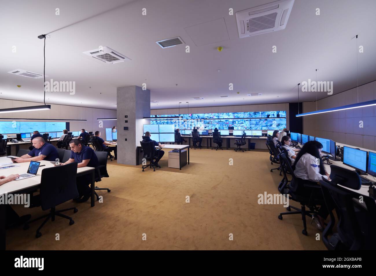 Group of Security data center operators working in a CCTV monitoring ...