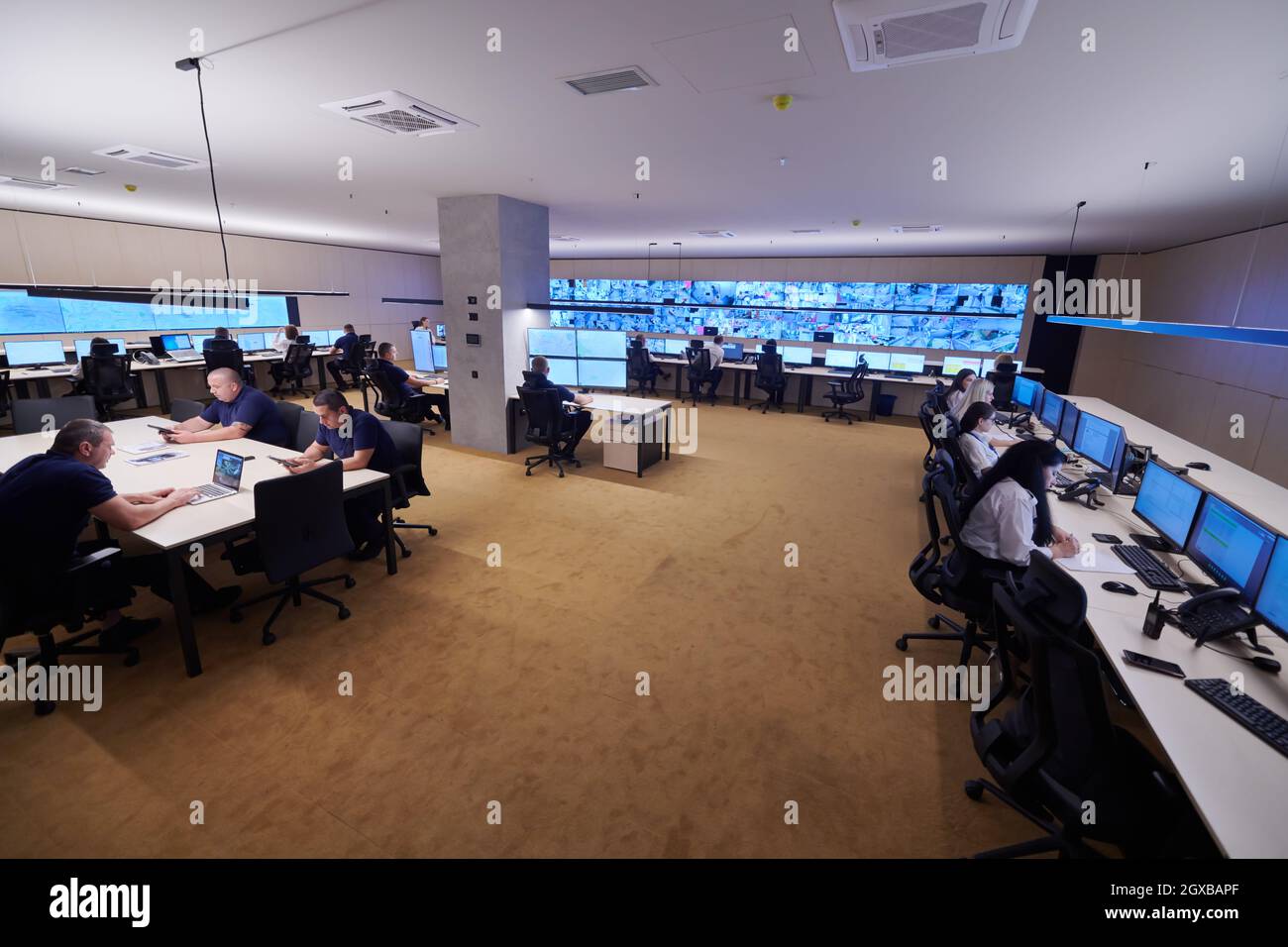 Group of Security data center operators working in a CCTV monitoring ...