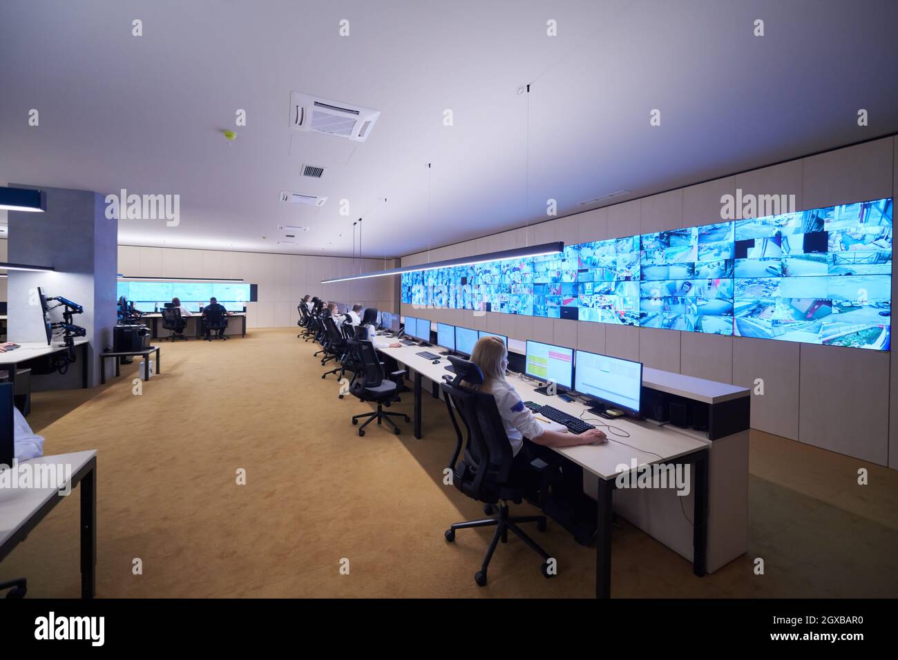 Group of Security data center operators working in a CCTV monitoring ...