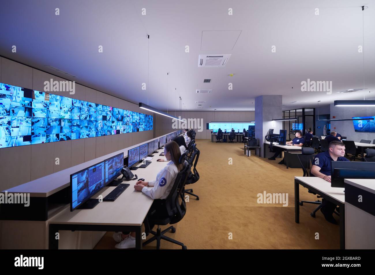 Group of Security data center operators working in a CCTV monitoring ...