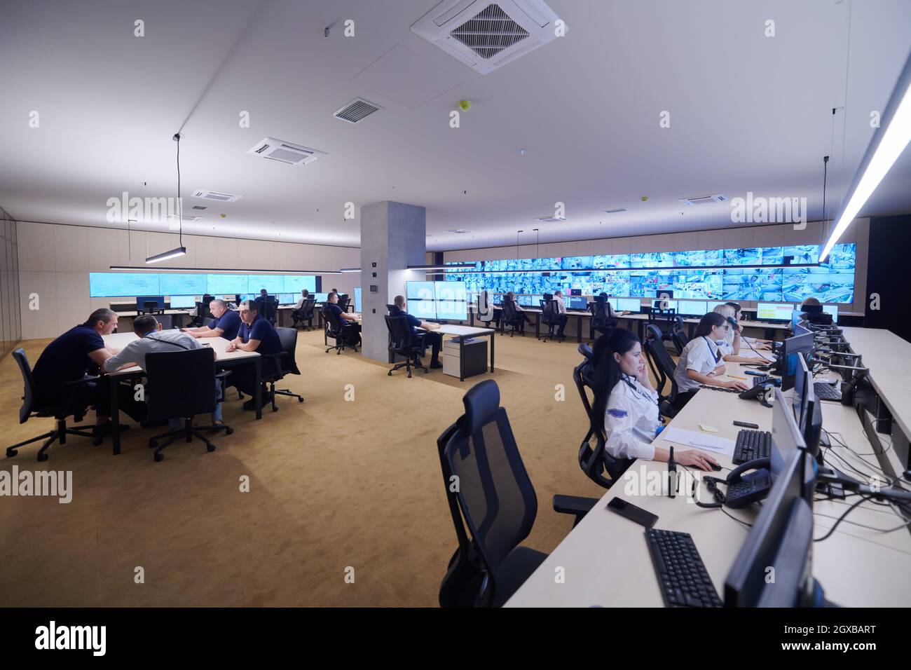 Group of Security data center operators working in a CCTV monitoring ...