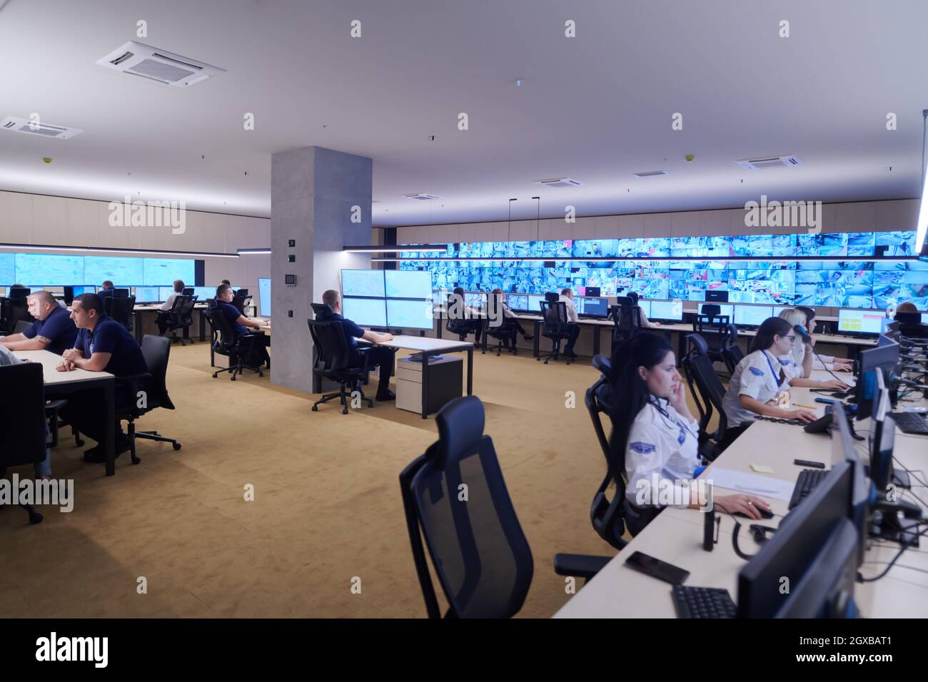 Group of Security data center operators working in a CCTV monitoring ...
