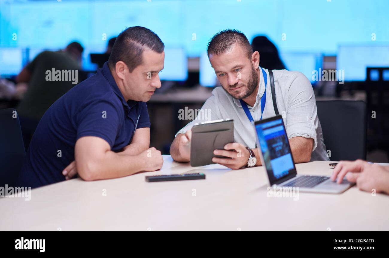 Group of security guards sitting and having briefing In the system ...