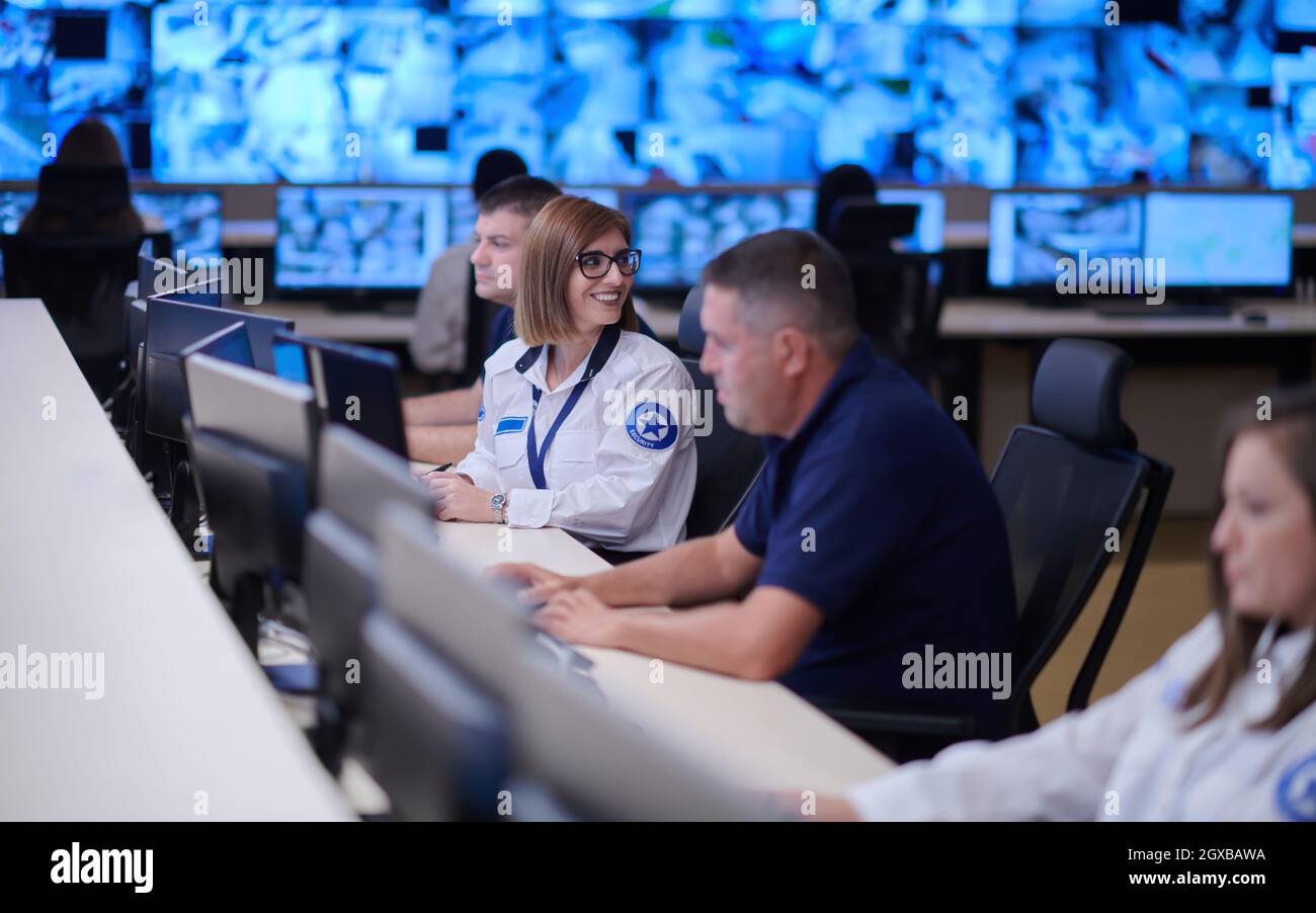 Group of Security data center operators working in a CCTV monitoring ...