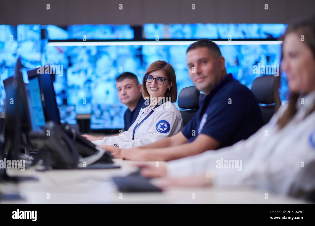 Group of Security data center operators working in a CCTV monitoring ...