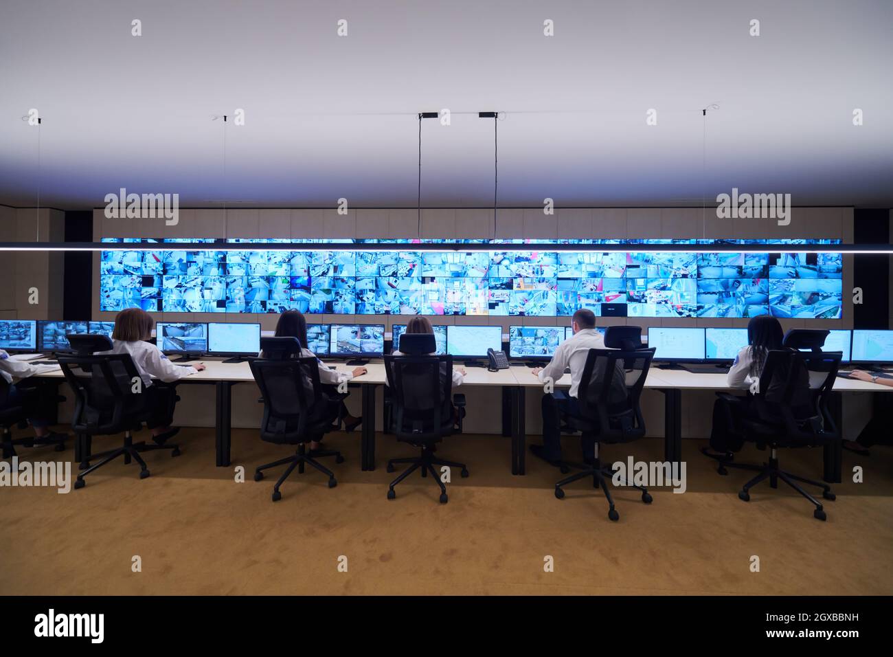Group of Security data center operators working in a CCTV monitoring ...
