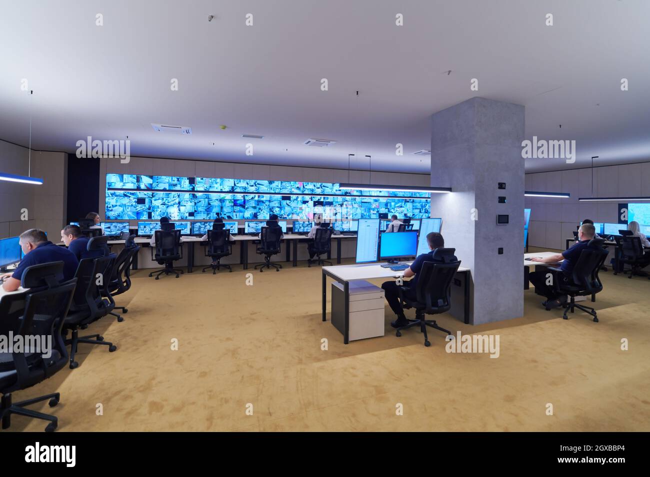Group of Security data center operators working in a CCTV monitoring ...