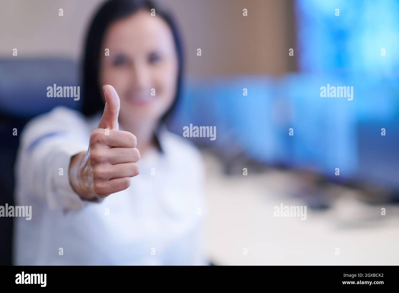 portrait of female security operator while working in a data system ...