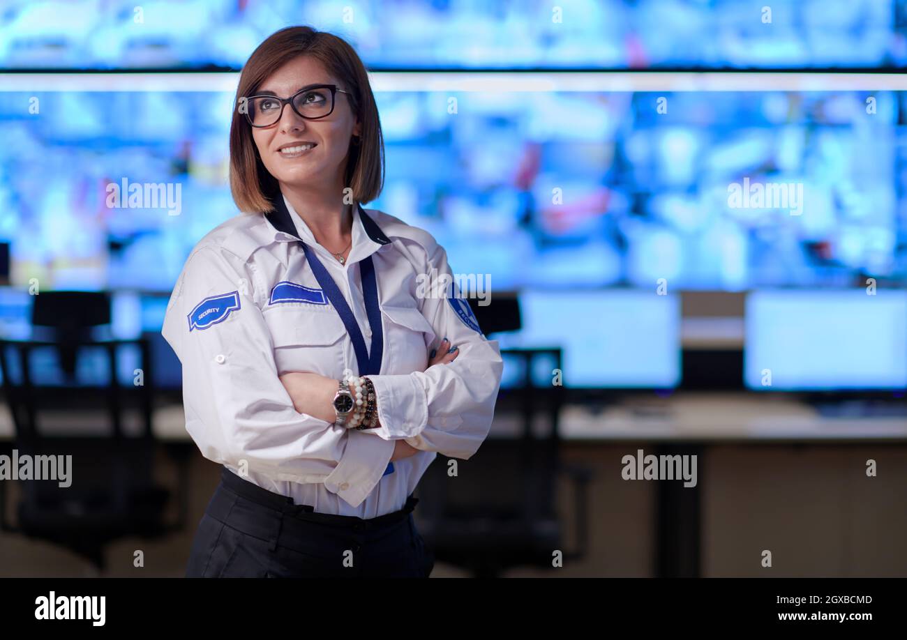 portrait of female security operator while working in a data system ...