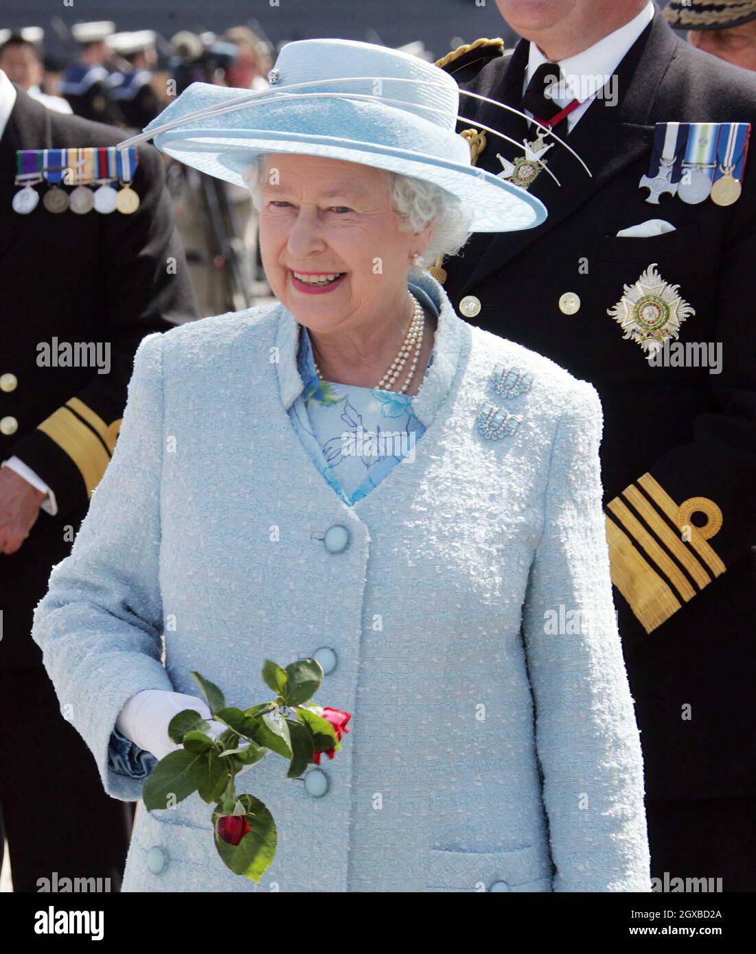 Queen Elizabeth takes a salute from Royal Navy troops from HMS Victory ...