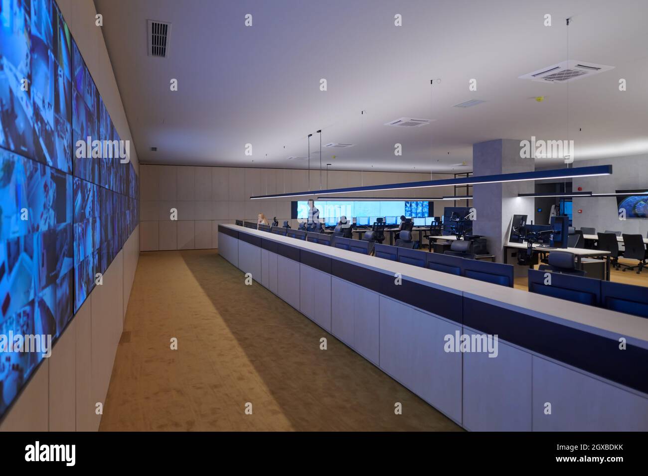 Empty interior of big modern security system control room, workstation ...