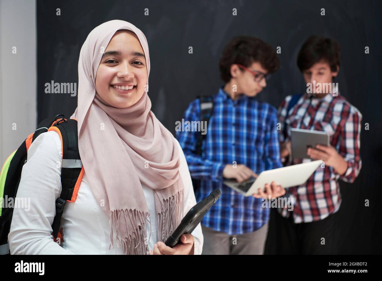 Arabic teenagers team, students group working together on laptop and ...