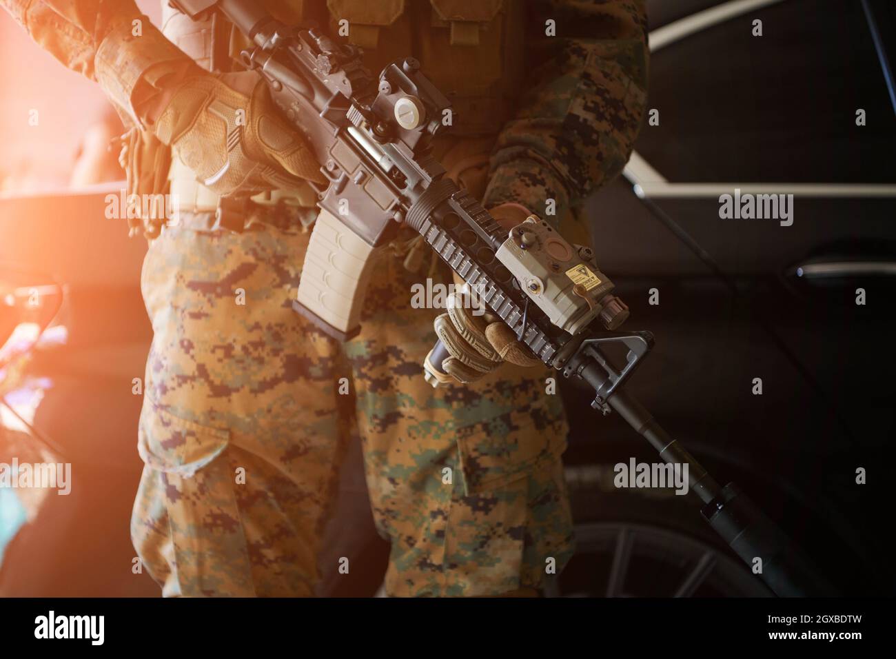 soldier protecting armored luxury vehicle a security guard in military ...