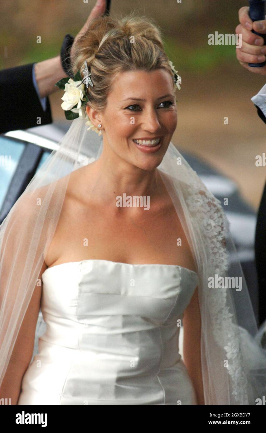 Sara Buys shelters under an umbrella as she arrives for her wedding to ...
