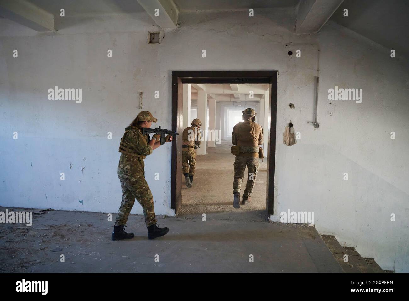 special forces soldiers team in urban environment making tactical ...